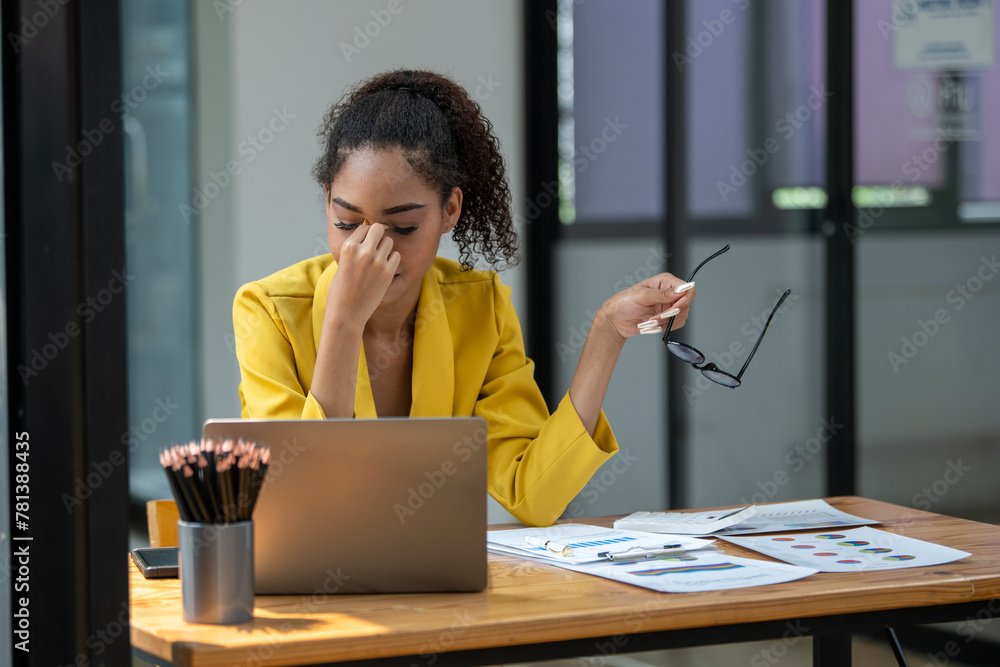 Distressed young businesswoman feeling pressure and headache at her ...