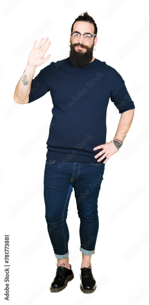 Young hipster man with long hair and beard wearing glasses Waiving ...