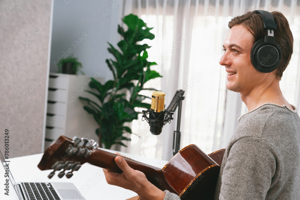 Host channel in smart singer with smiling face, playing guitar along ...