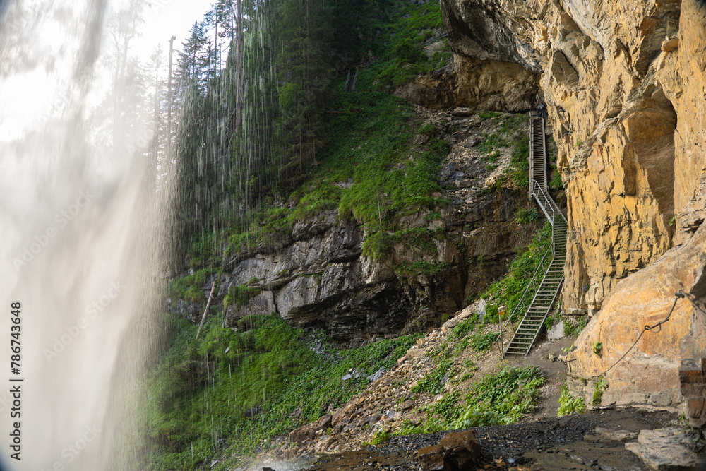 waterfall from a high cliff. water flow down.Streams of water crash on ...
