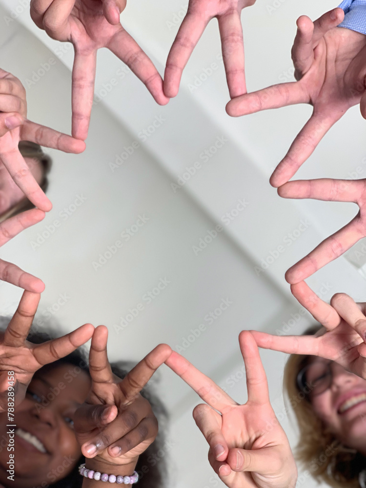 Hands of young people in the shape of a star made of fingers. Teens ...