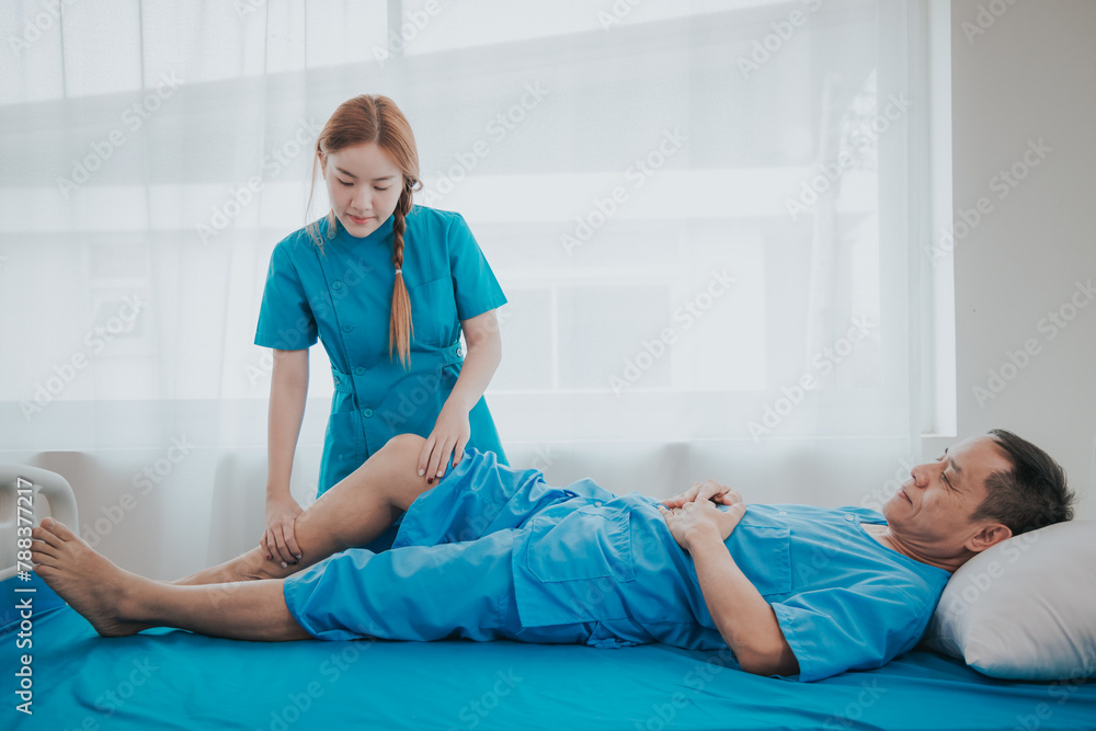 Asian female physiotherapist helping senior older woman stretching ...