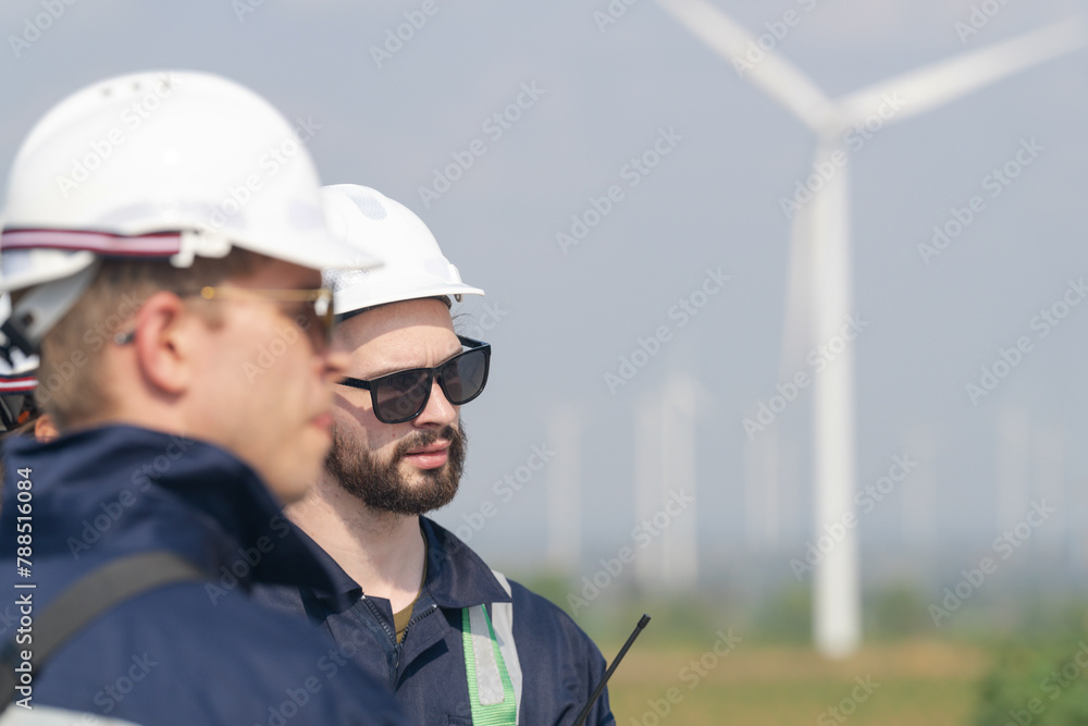 Wind farm engineers conducting a field assessment for turbine ...
