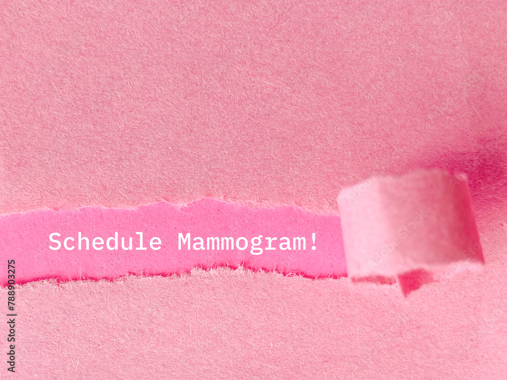 Text of schedule mammogram behind torn paper background. stock photo ...