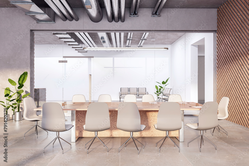 A modern conference room with a large wooden table, grey chairs, and ...