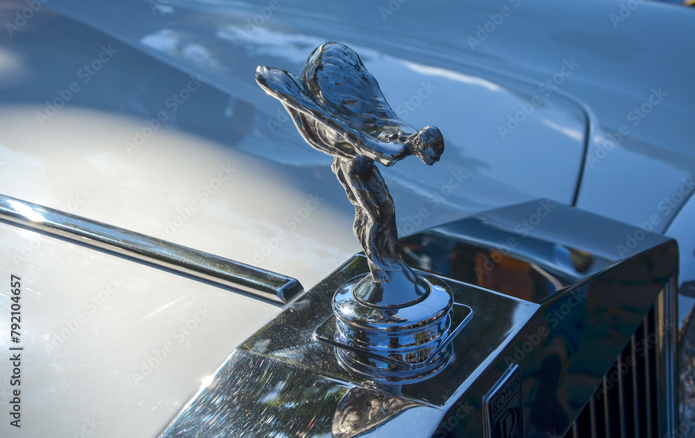 Logo emblem on the car hood of luxurious white collectible rare ...