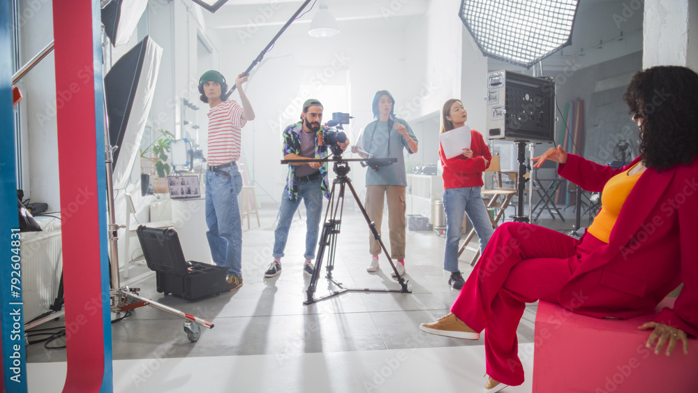 Diverse Team Engaged In A Creative Film Shoot In A Bright Studio ...