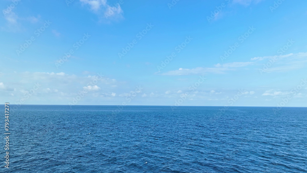 Unending waves cascade upon the tranquil sea, as a drone glides ...