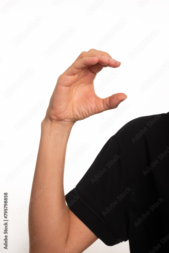 Close-up of a female arm and hand making the letter C in the Brazilian ...