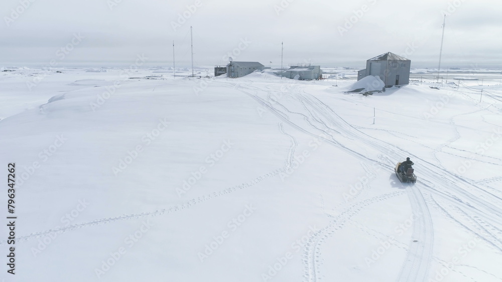 Man Riding On Vintage Snowmobile. Aerial Antarctica Flight. Man Using ...