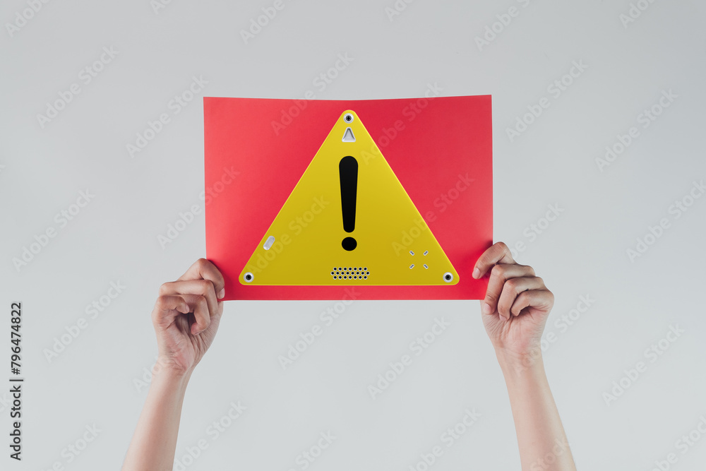 Hand Showing Red Paper with Yellow Warning Sign Symbolic Representation ...