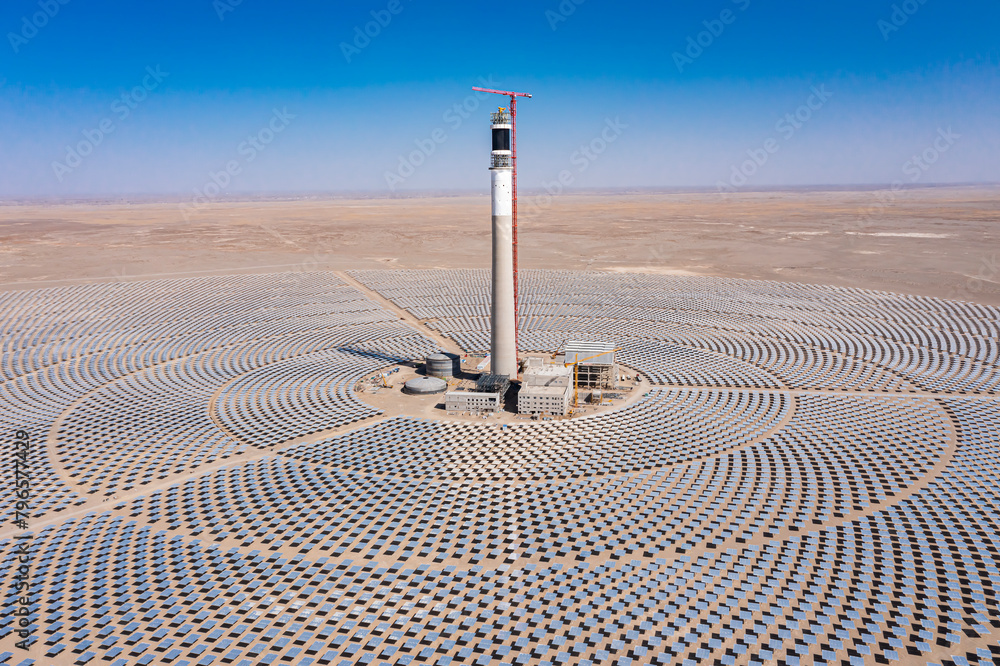 Molten salt tower type solar thermal power station under construction in the desert Gobi Stock ...