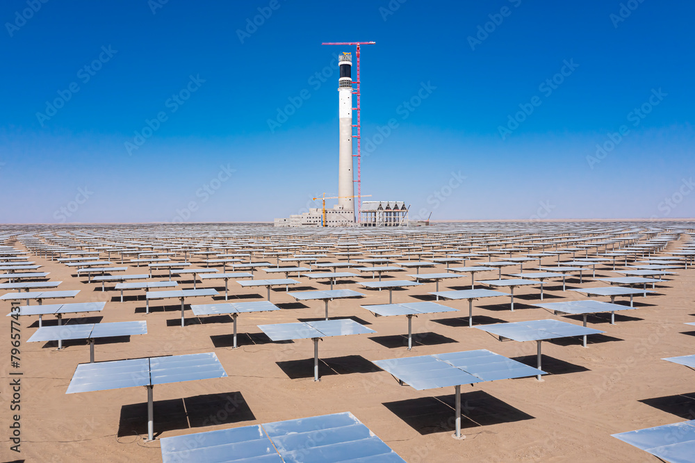 Molten salt tower type solar thermal power station under construction in the desert Gobi Stock ...