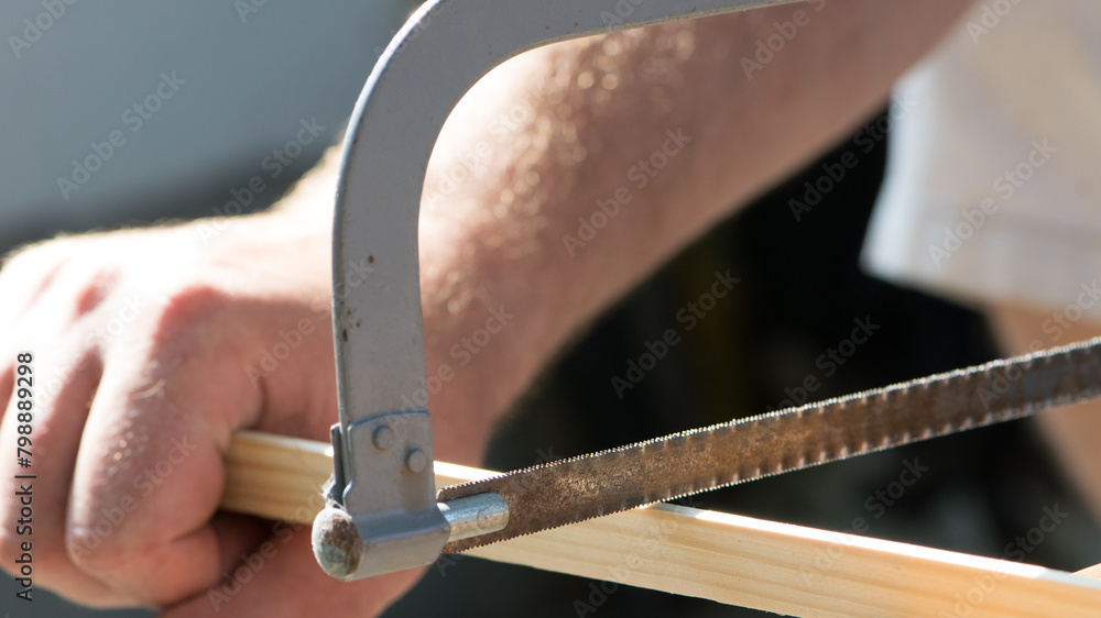 Hand saw with hardened teeth isolated. saw in hand, hacksaw at work ...