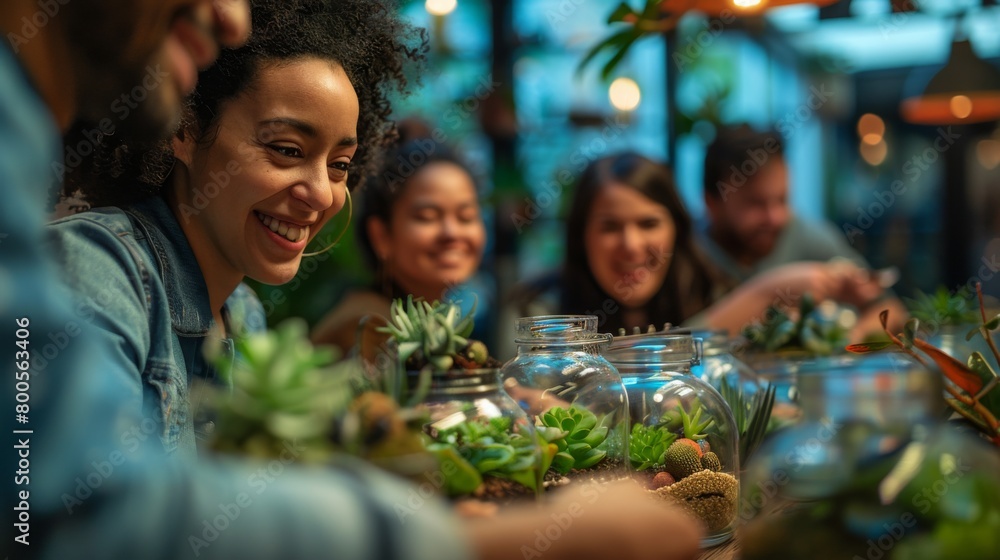 A group of coworkers participating in a team-building workshop, making ...