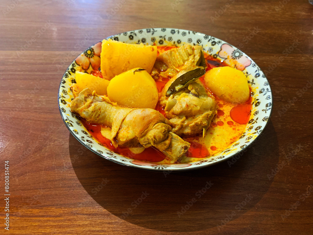 signature Malay nonya spicy chilli curry leaf chicken and potato in ...