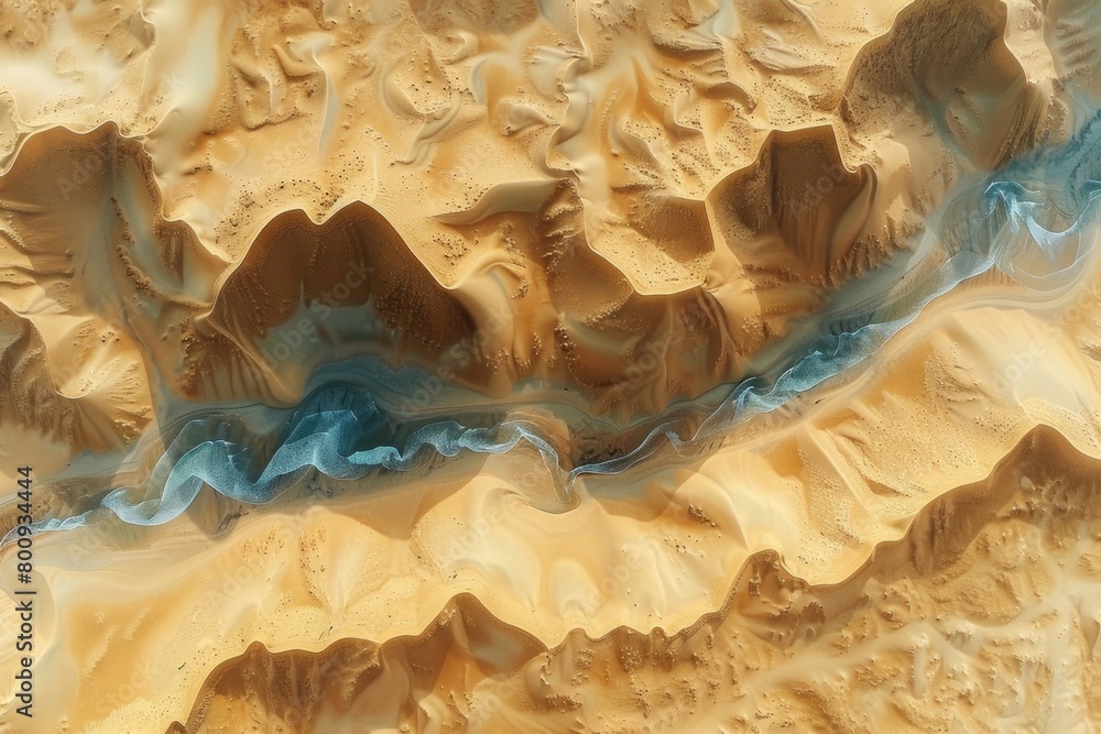 From the bird's-eye view, observe the sandy expanse taking shape, its ...