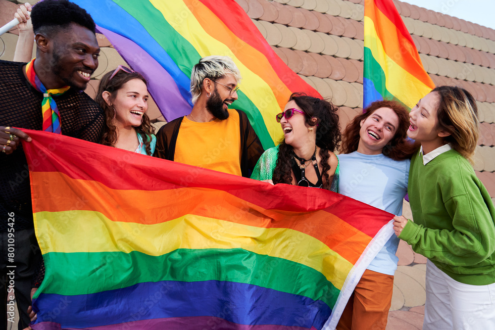 Happy image of a group of LGBTQIA having fun celebrating together at ...