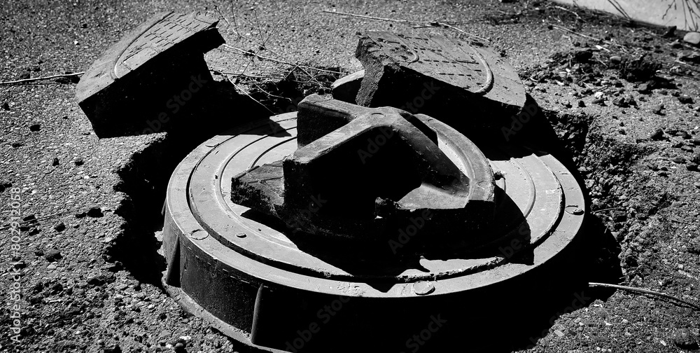 Manhole cover. Abstract grunge background. Black and white photo ...