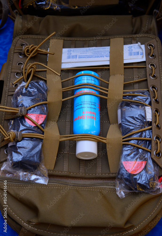 Backpack with soldier s first aid kit: bandages, wound-healing drugs ...