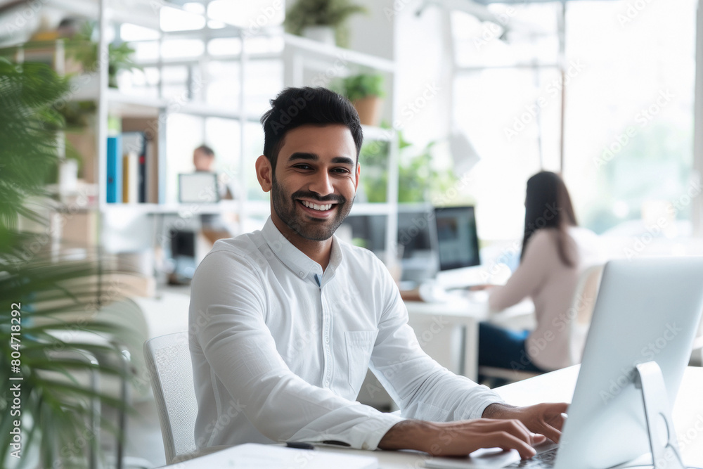 indian man working on computer in modern office Stock Photo | Adobe Stock
