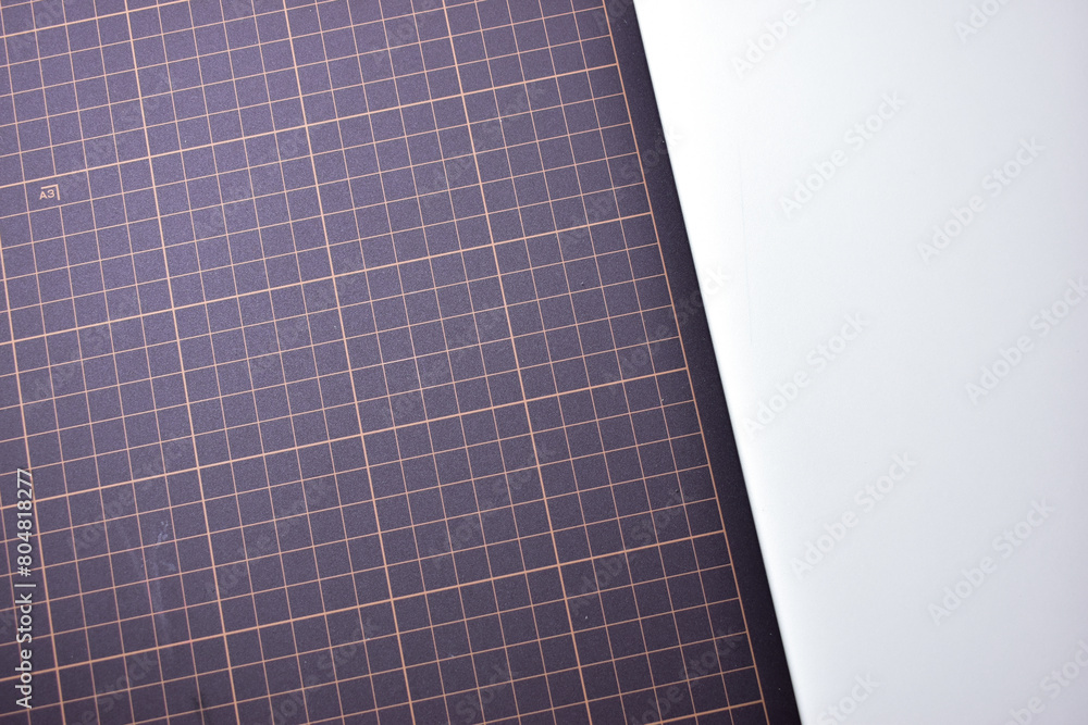 black cutting mat board on white background with line and scale measure ...