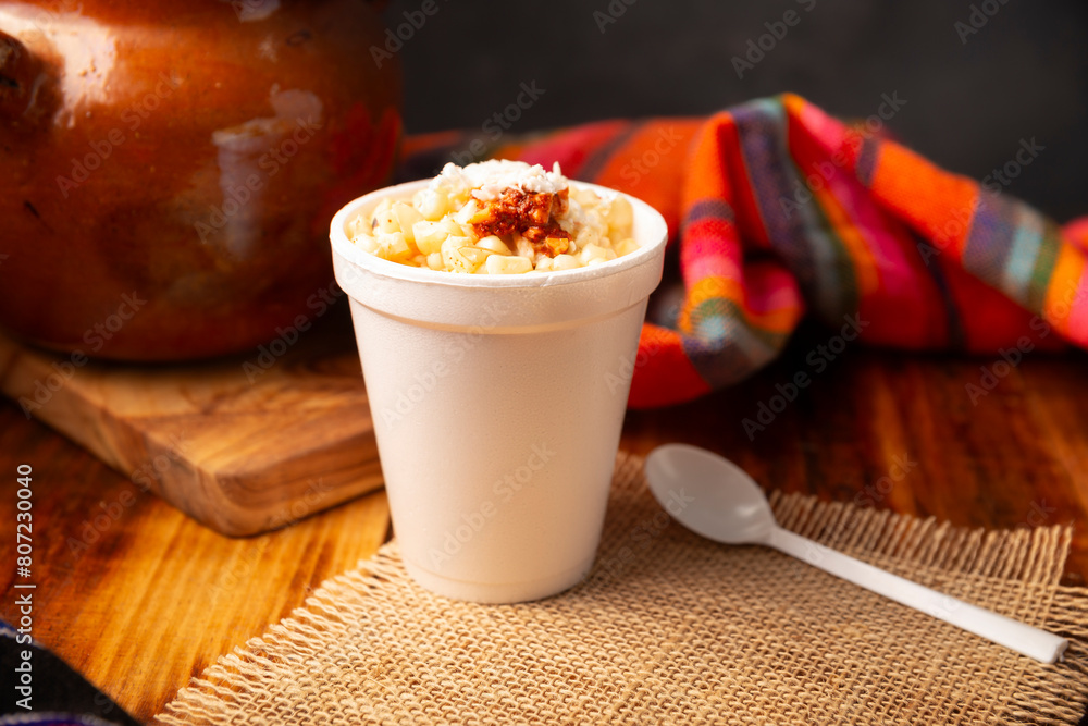 Esquites. Corn kernels cooked and served with mayo, sour cream, lemon ...
