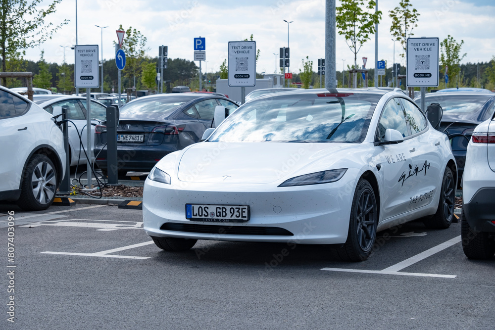 Tesla model y electric car on Free charging station, Tesla-Supercharger ...