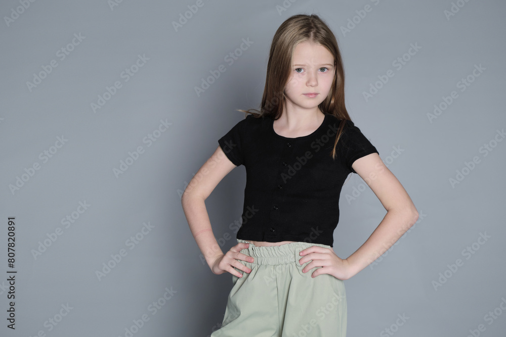 Child in a power pose, looking ahead with determination. Symbolizes the ...