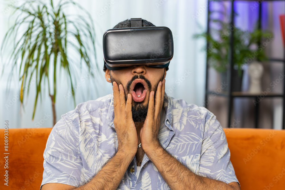 Indian man using virtual reality futuristic technology VR app headset ...