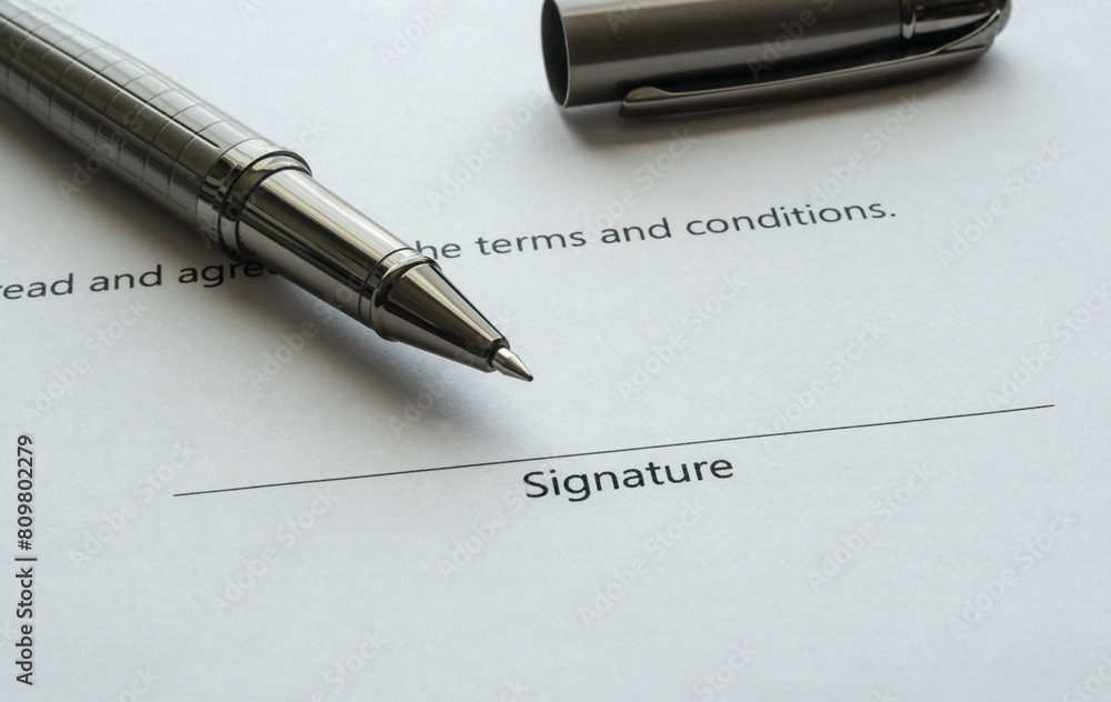 pen on a document to sign. letter to be signed and pen on paper ...