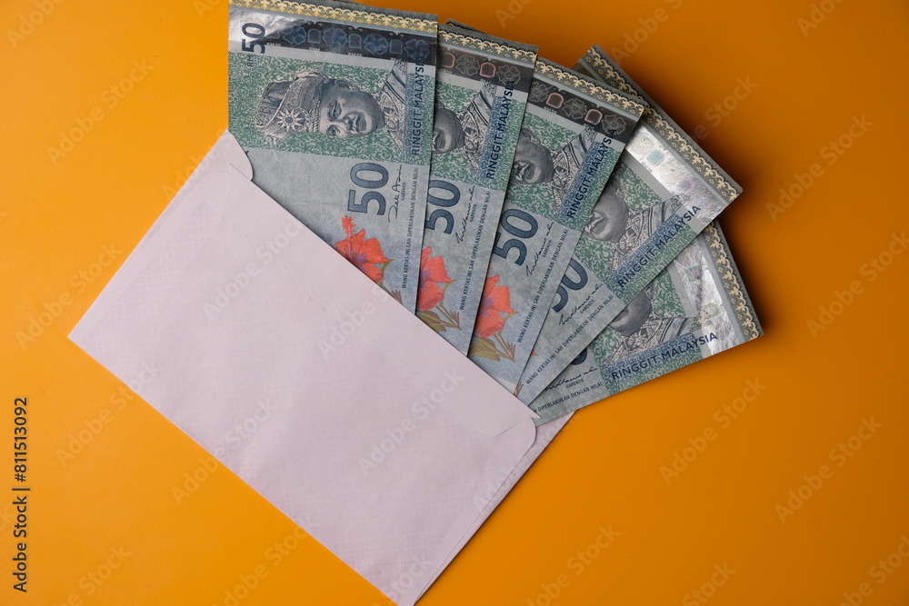 fifty Malaysian ringgit notes in an envelope. economic concept. RM ...