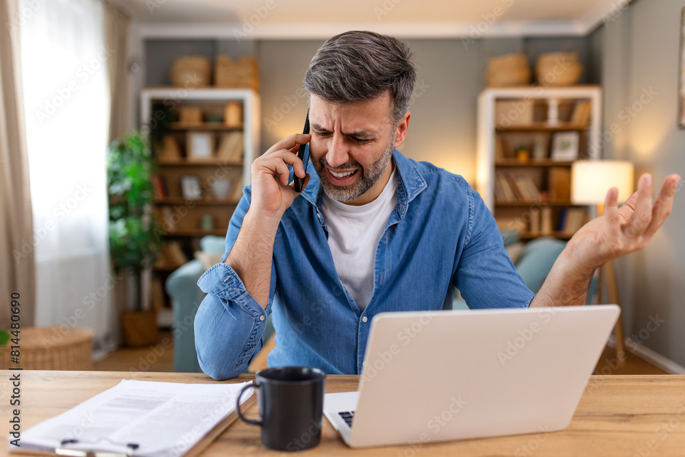 Stock-Foto „Frustrated business man having a phone call at his office ...