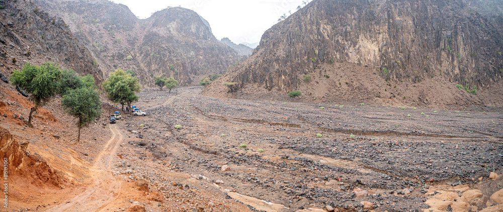 Dry Valley created by a black volcanic rock near the Grand Bara Desert ...