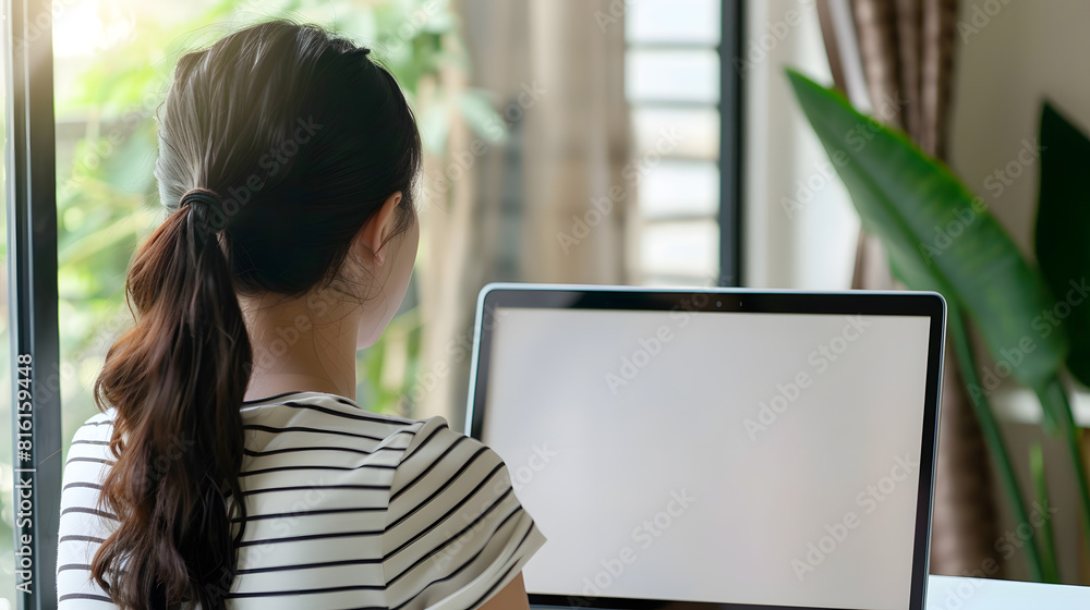 Business woman worker or student elearning looking at white mock up blank screen using laptop ...