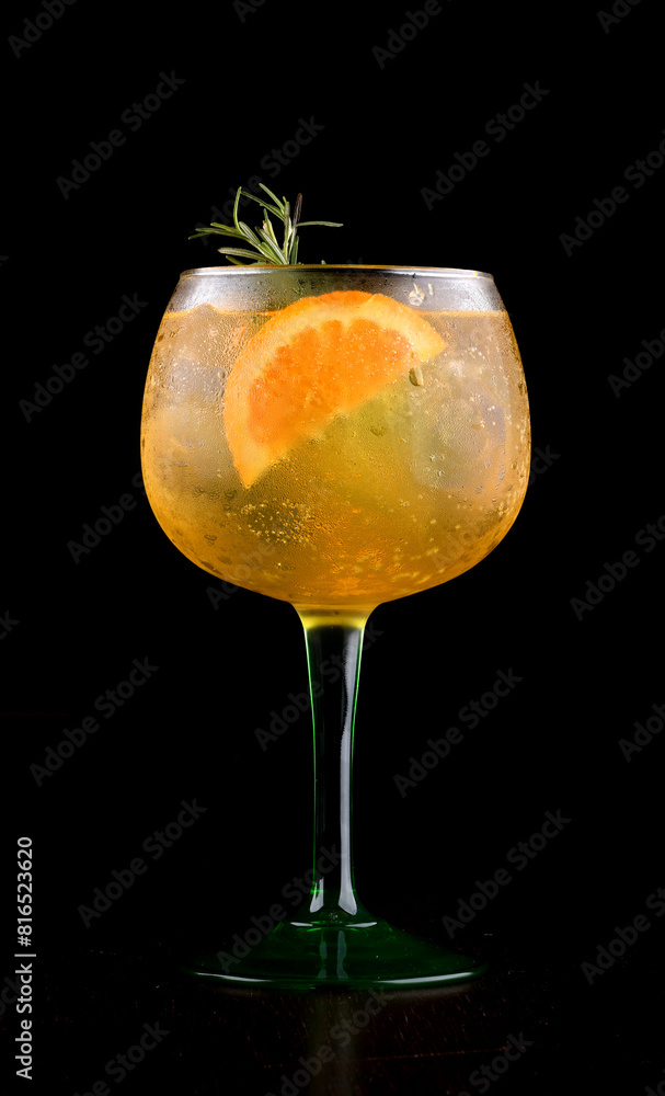 glass of tropical gin cocktail with orange and rosemary isolated on ...