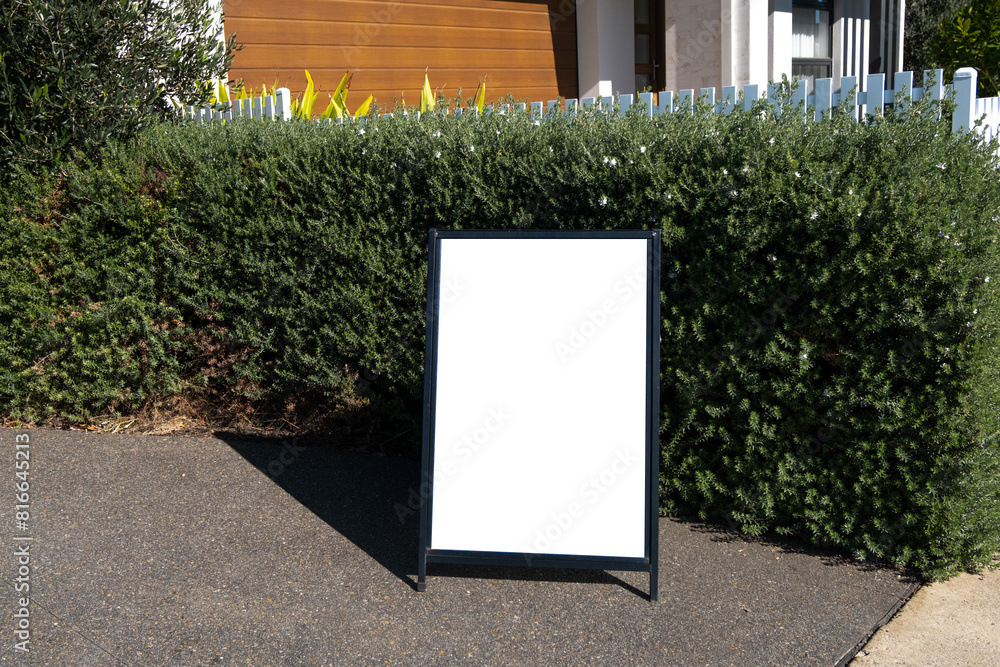 A blank white mockup background texture of a signboard against a garden ...