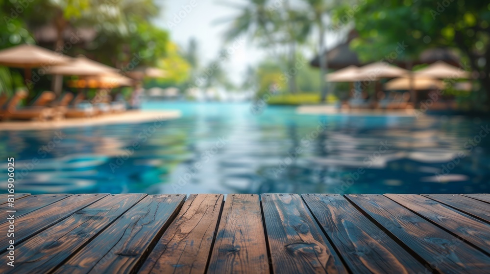 Image of wood table in front of swimming pool blur background. Brown ...