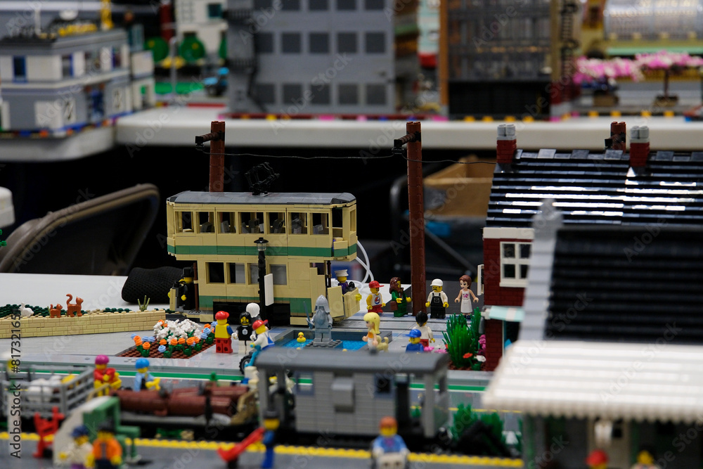 a city completely made of Lego blocks houses cars streets trains trams ...
