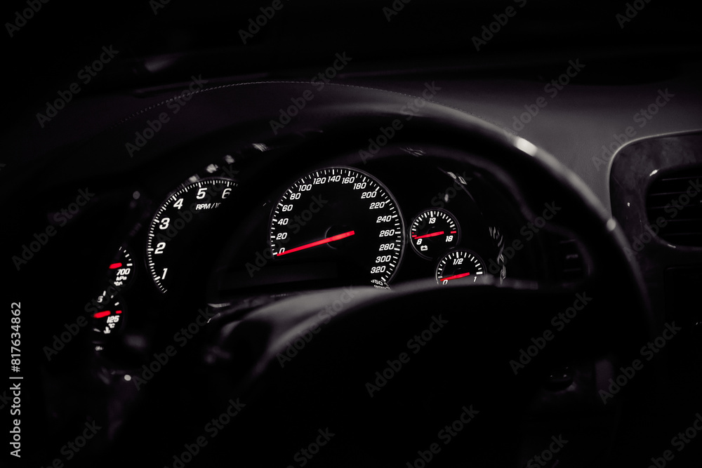 Gauge cluster of C6 Chevrolet Corvette Z06 at night. Dashboard view of ...