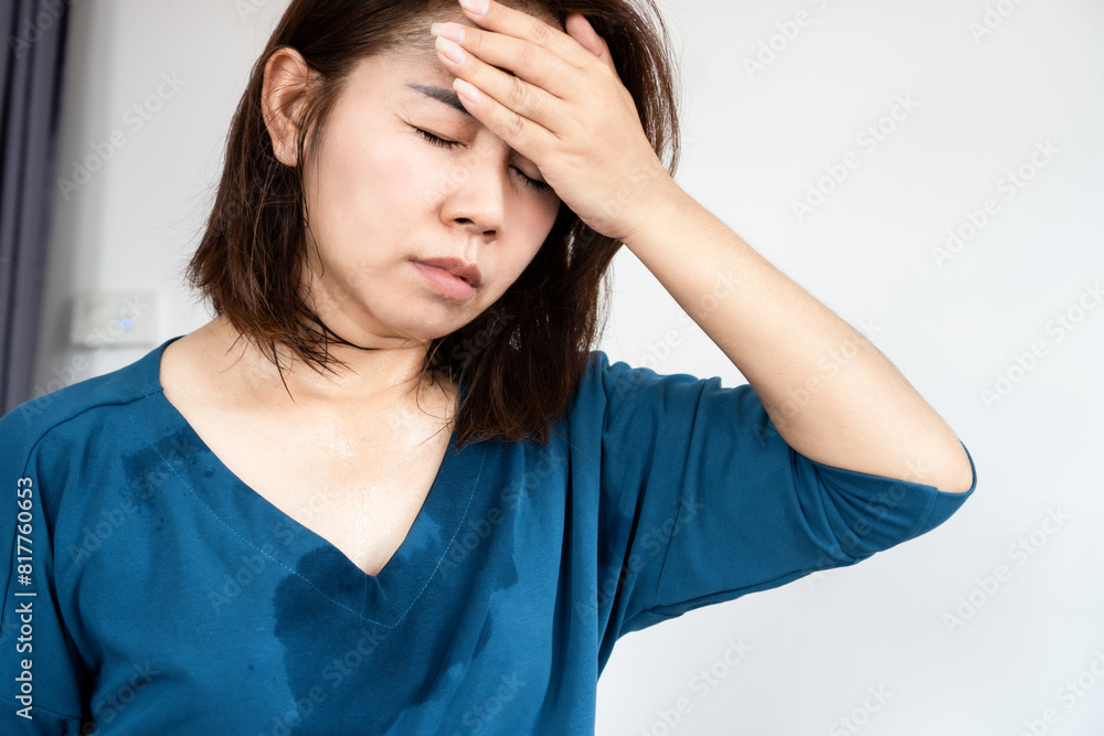 sweating asian woman feeling dizzy and fainting because of hot weather ...