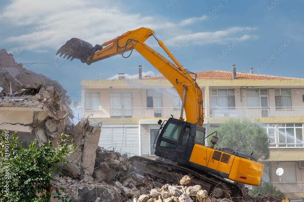 Building demolition excavator with long mechanical arm. Destruction of ...
