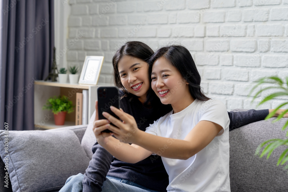 Asian Lesbian Couple Two Happy Asian Girls Smiling At Home Sit And Take 7252