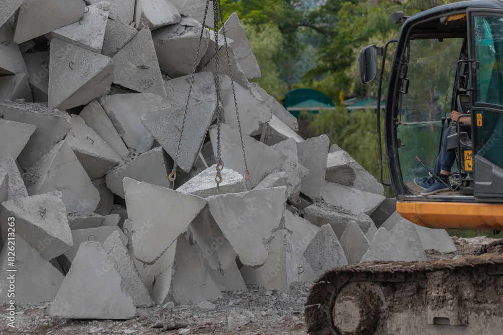 Loading and transporting dragon teeth for defense. Concrete pyramids ...
