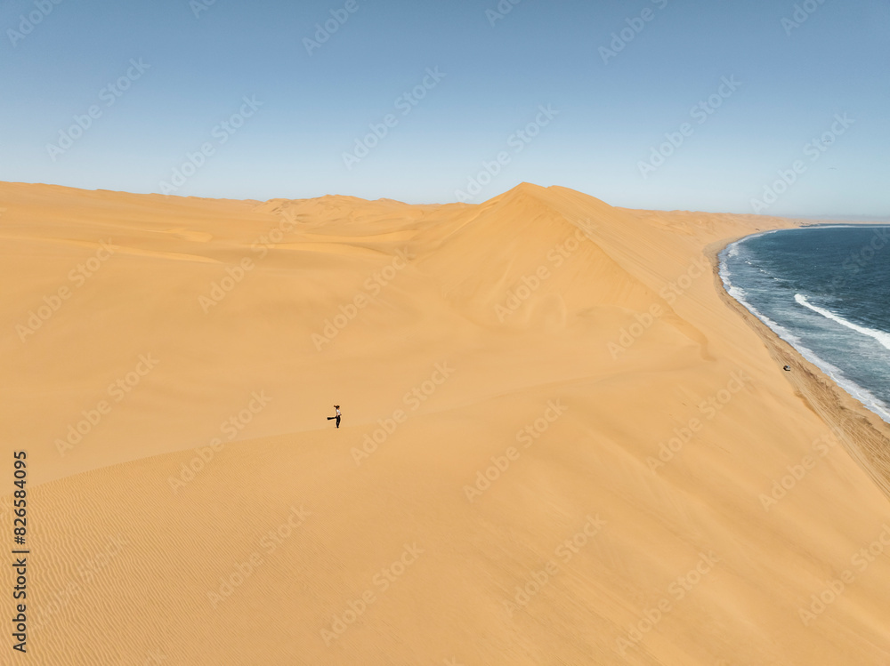 Aerial view of sand dune formations meeting the ocean at Sandwich ...
