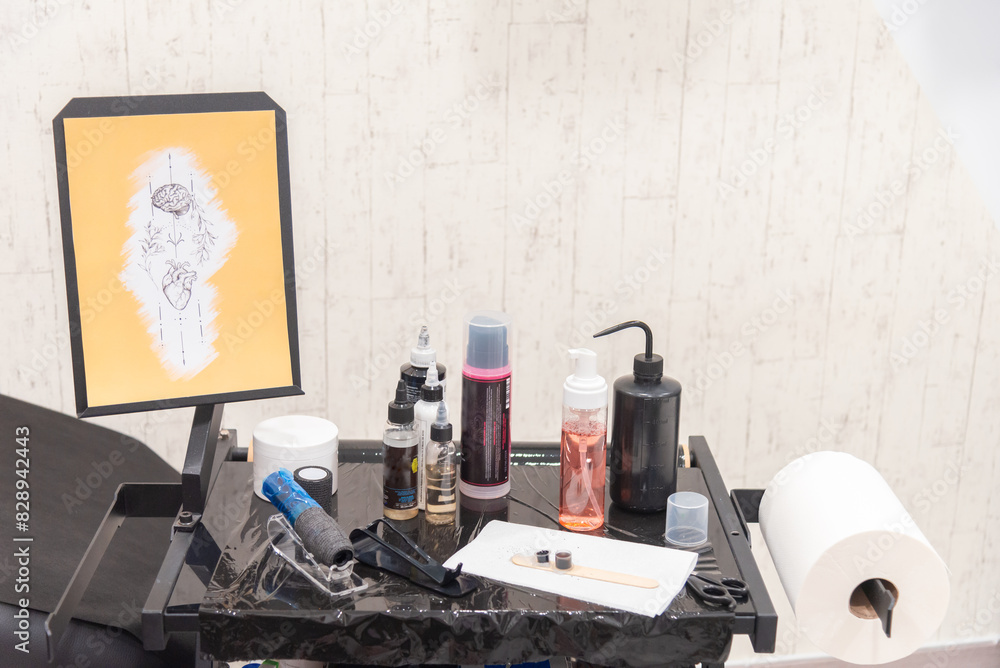 Tattoo artist's workstation with equipment and design Stock Photo ...