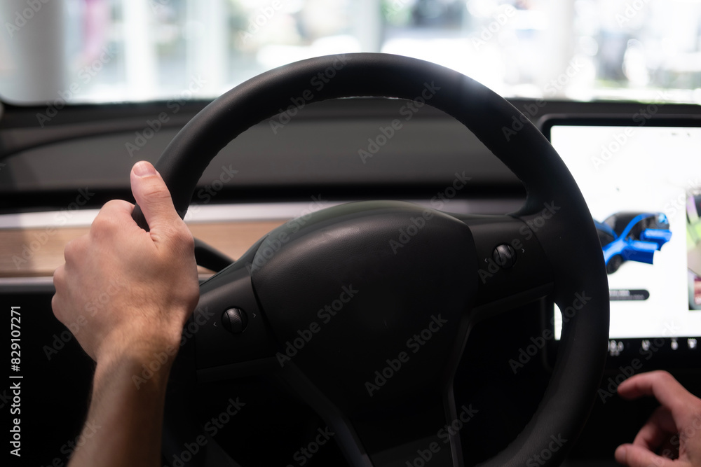 cockpit, male hand on Driver's column, Behind steering wheel electric ...