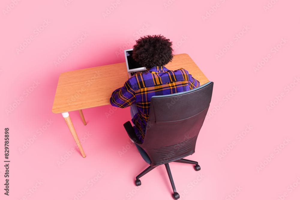 Top back view photo of worker guy sit desk table working netbook ...