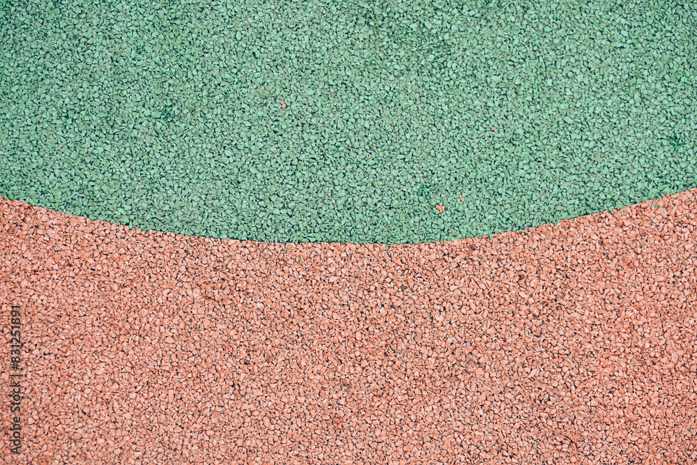 Green and orange rubber coating for playgrounds. EPDM rubber granules ...
