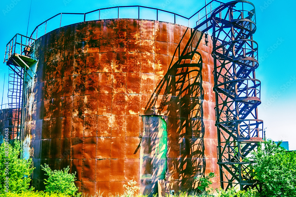 Old rusty oil tanks (fuel reservoir, oil barrel). Evidence of economic ...
